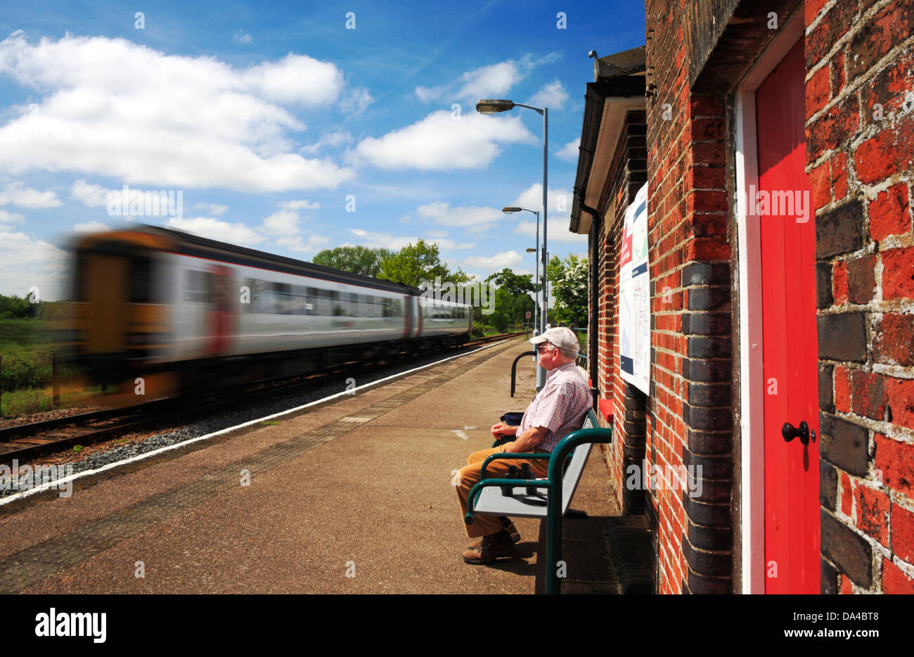 Man sitting on seat railway hi-res stock photography and images - Alamy