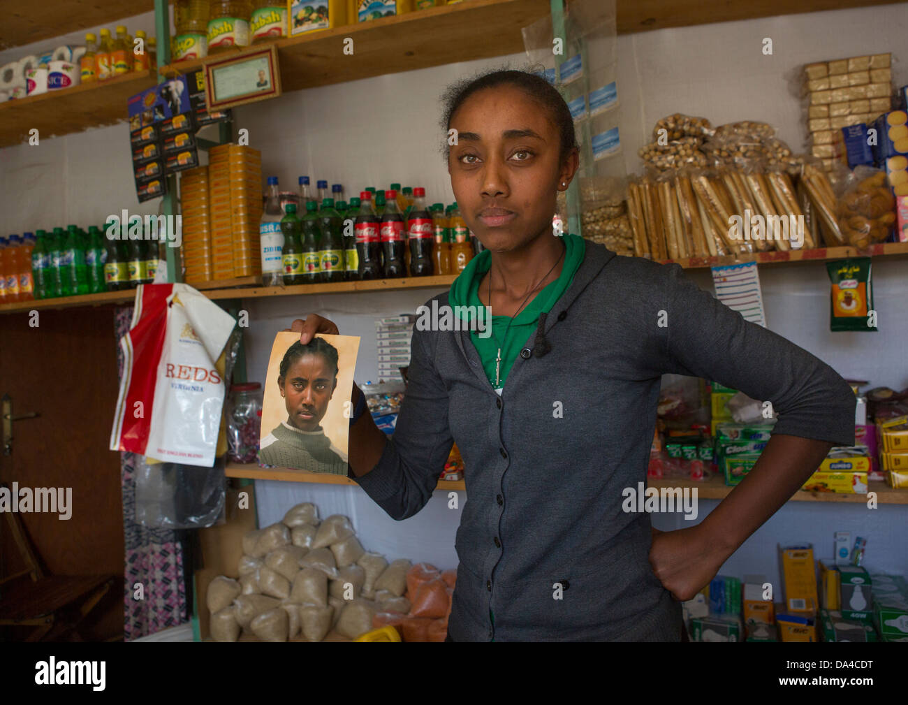 Eritrean Woman Showing An Old Picture Of Herself, Dekemhare, Eritrea ...