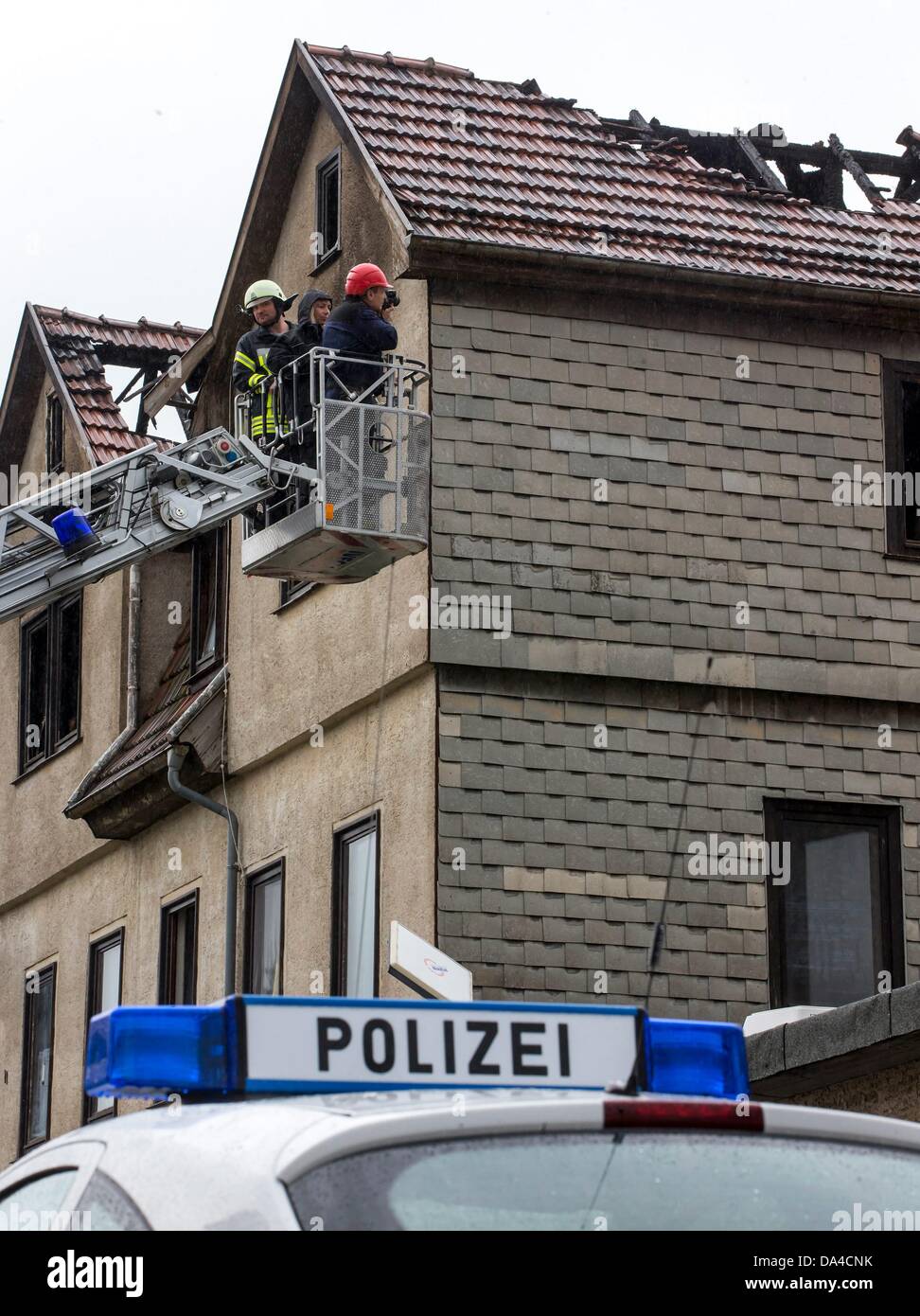 Rescue works investigate a burned out home in Brotterode, Germany, 03 ...