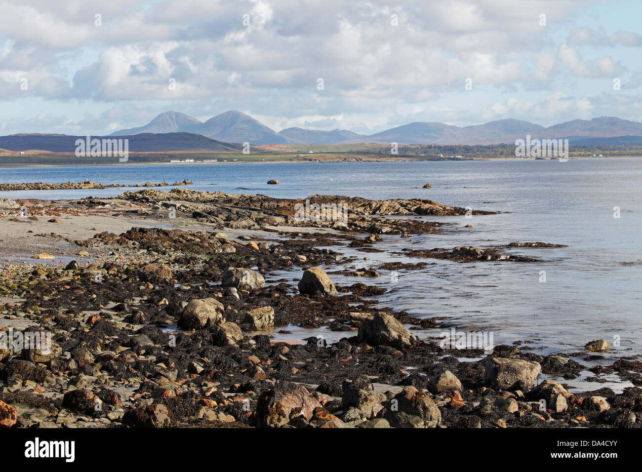 Loch Indaal looking from the west shore towards Bridgend with the Paps ...