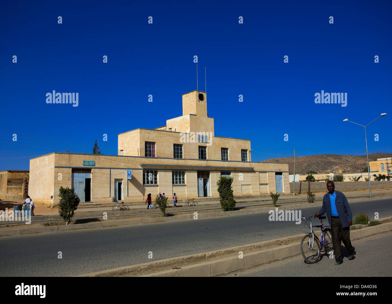 Man Passing In Front Of An Old Colonial Italian Factory, Dekemhare ...