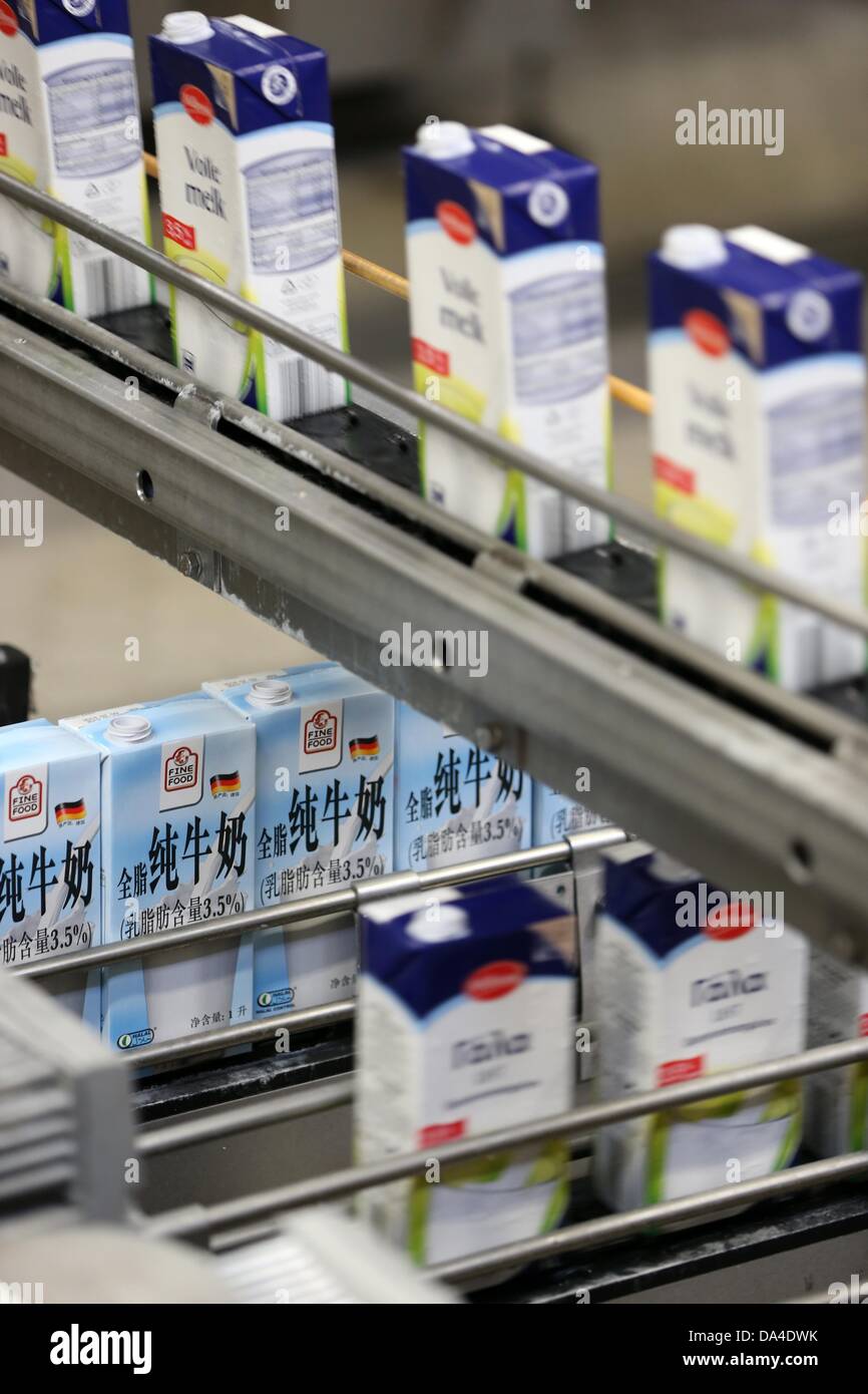 Cartons of milk destined for the market in China run through the ...