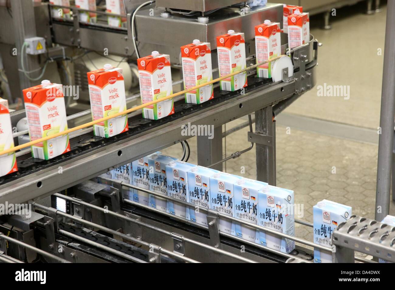 Cartons of milk destined for the market in China run through the ...