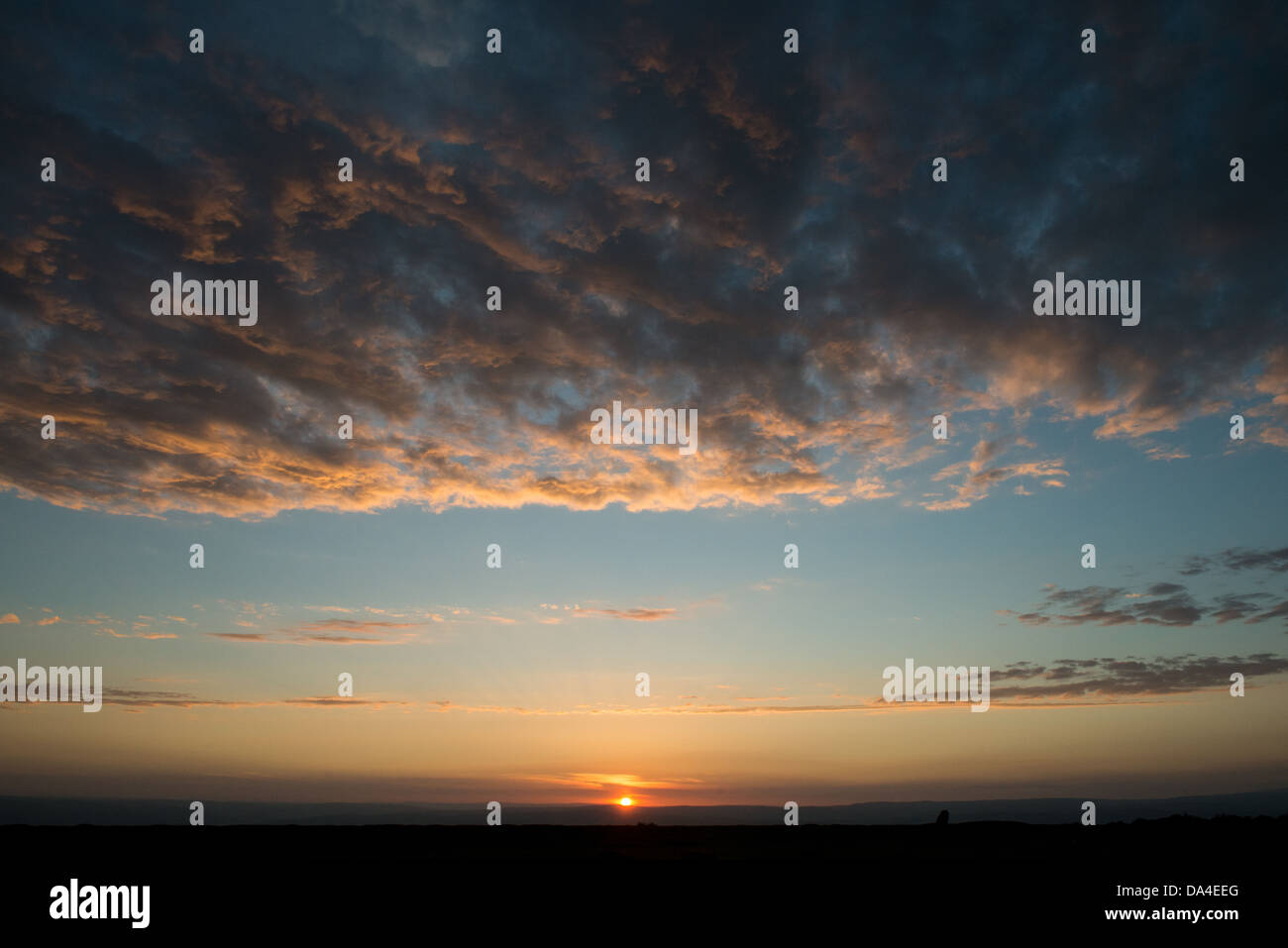sunset over a quiet landscape Stock Photo - Alamy