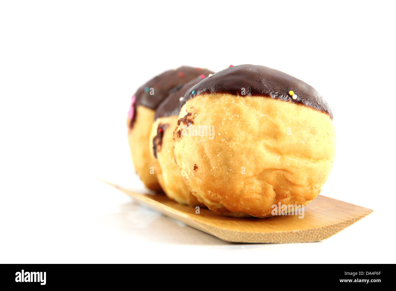 Chocolate donuts in the Bamboo dish on the white background Stock Photo ...