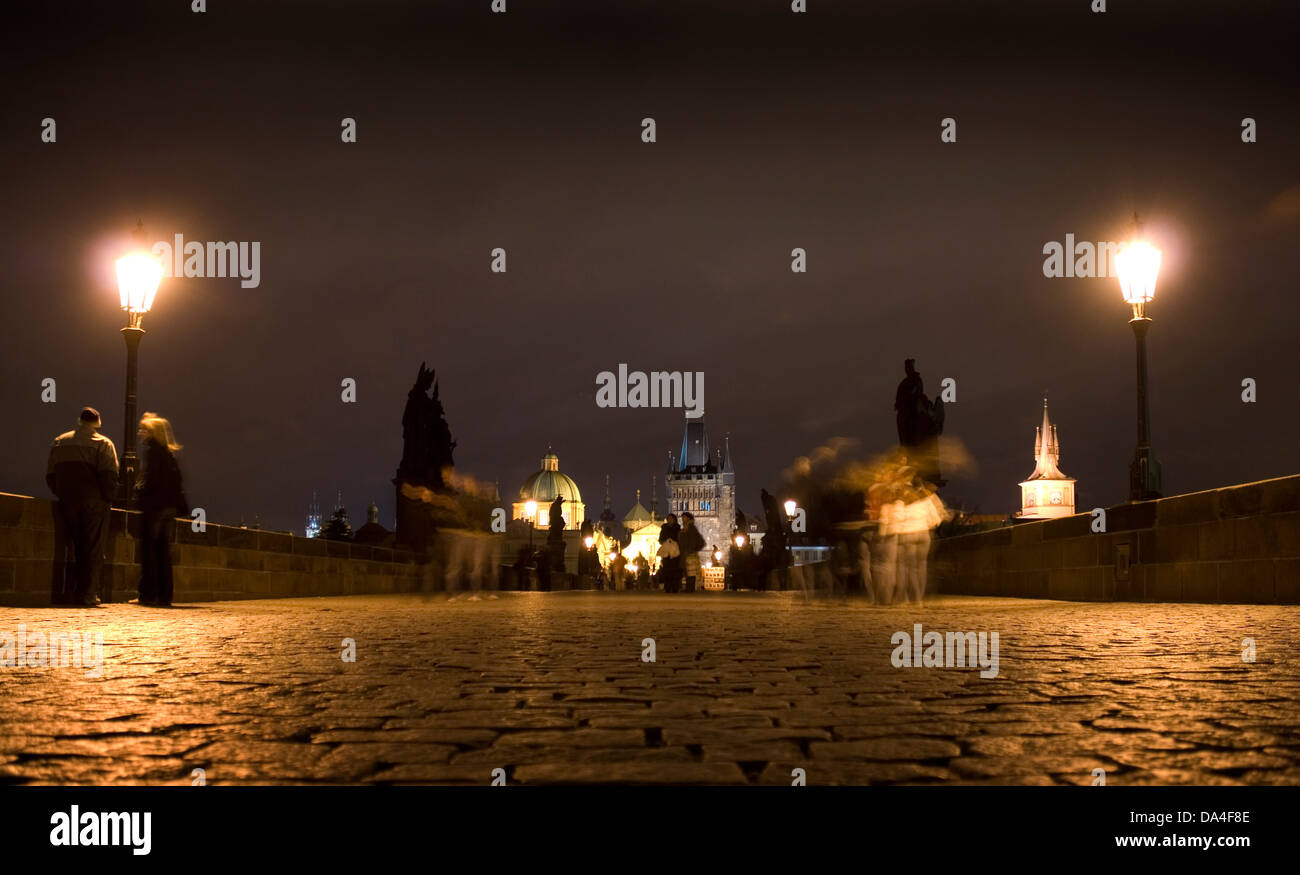 Pedestrian walking on Charles Bridge in Prague at night Stock Photo - Alamy