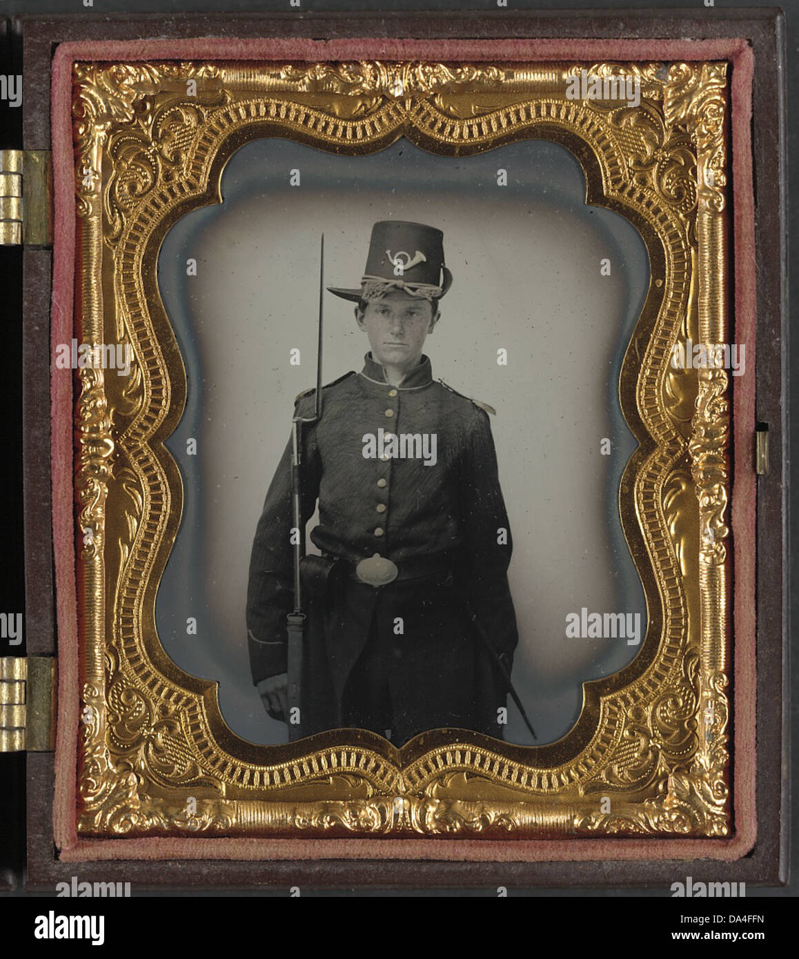 This photograph shows a young Union soldier wearing a Hardee hat and ...