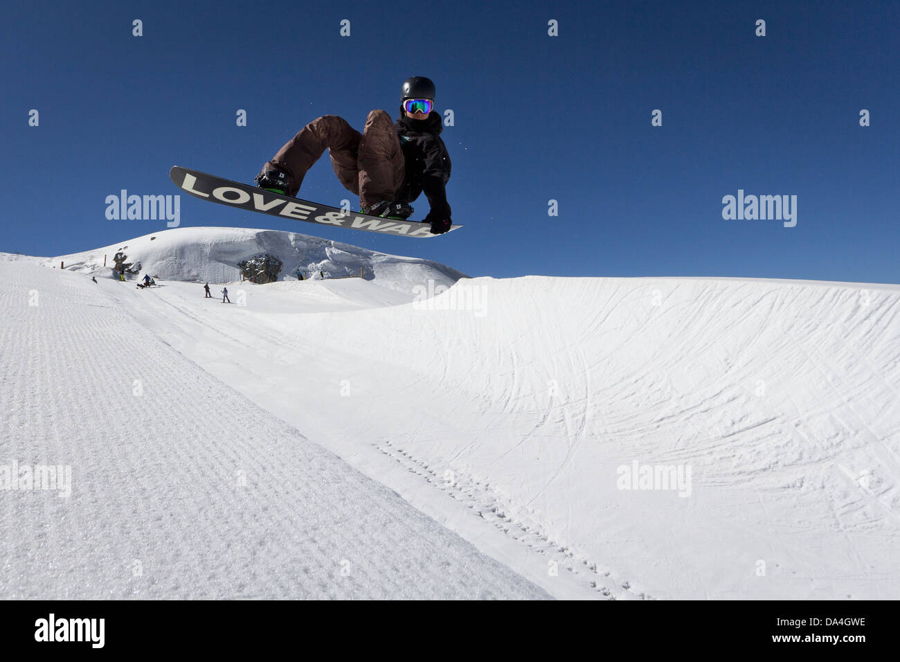 The Swiss snowboarder Tim Basler is jumping in a halfpipe on the ...
