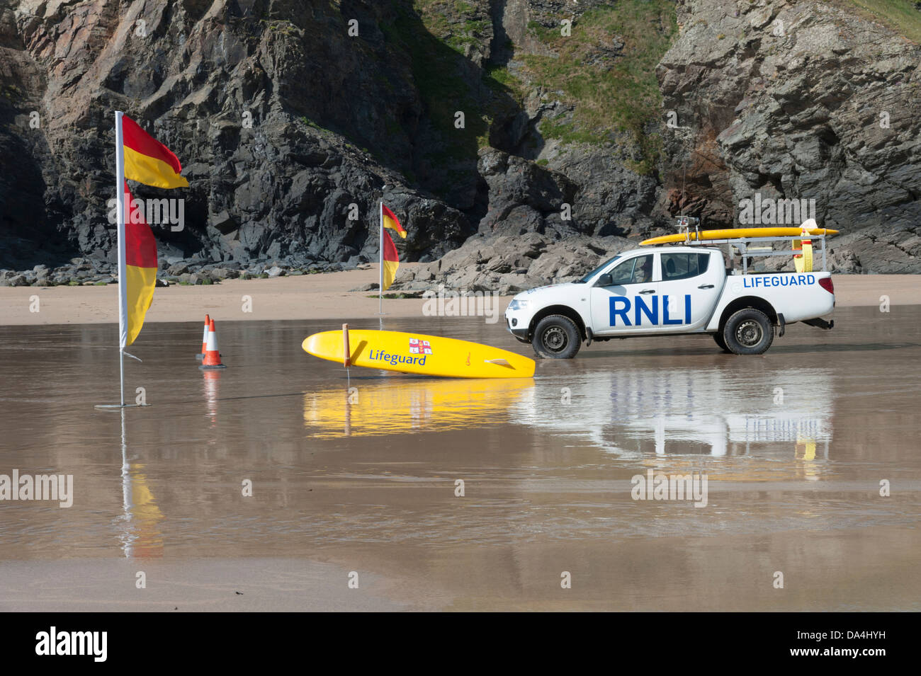 The RNLI lifeguards and their vehicle on the beach at Porthcothan Bay ...