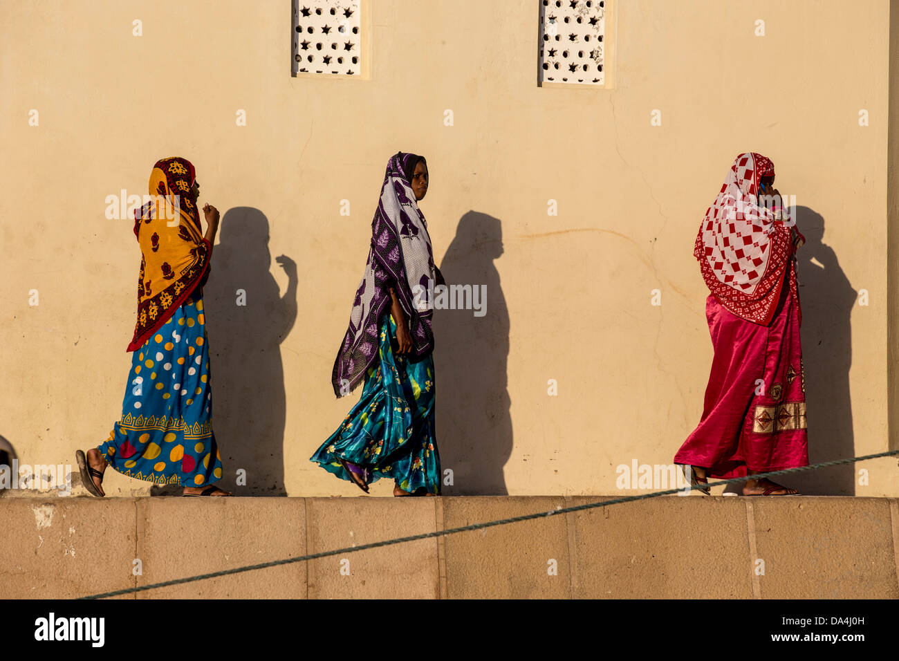 Muslim women at sunset in downtown Stone Town, Zanzibar Tanzania Stock ...