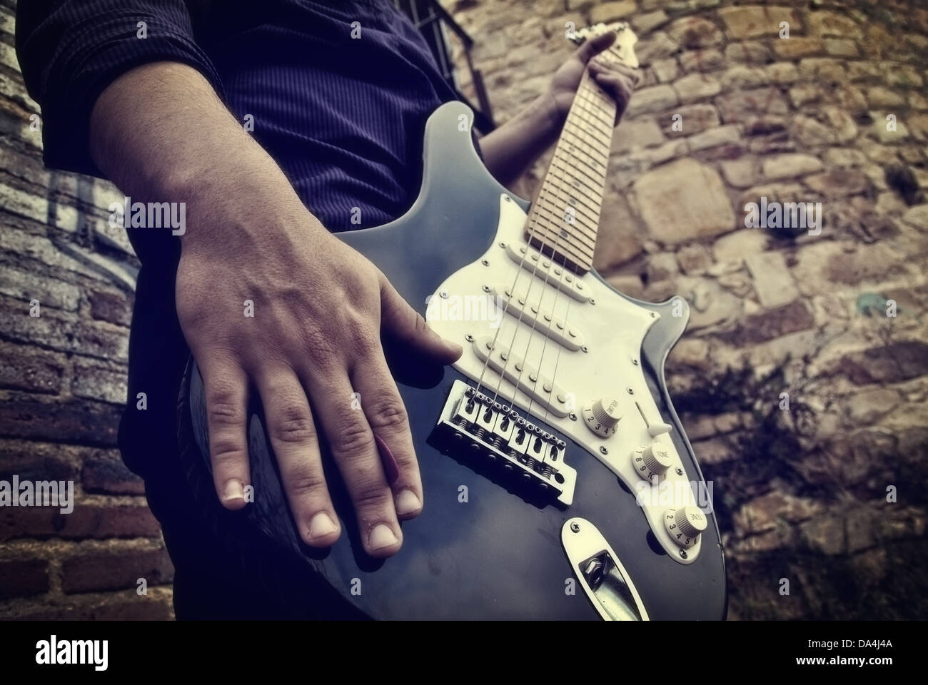 electric guitar being played by a rocker Stock Photo - Alamy