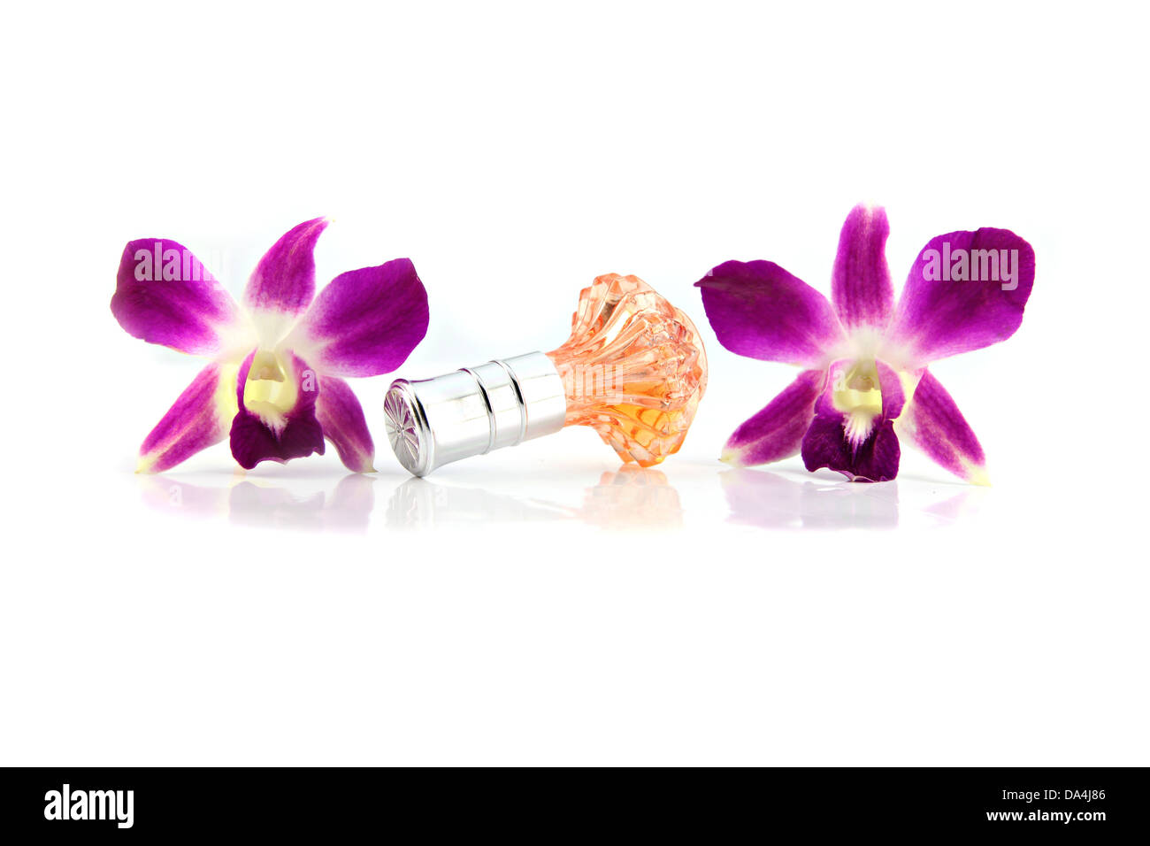 The Purple orchid and Orange Perfume bottles on the white background ...