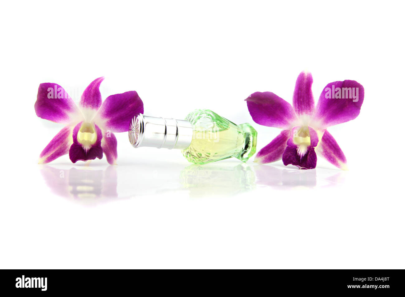The Purple orchid and Green Perfume bottles on the white background ...
