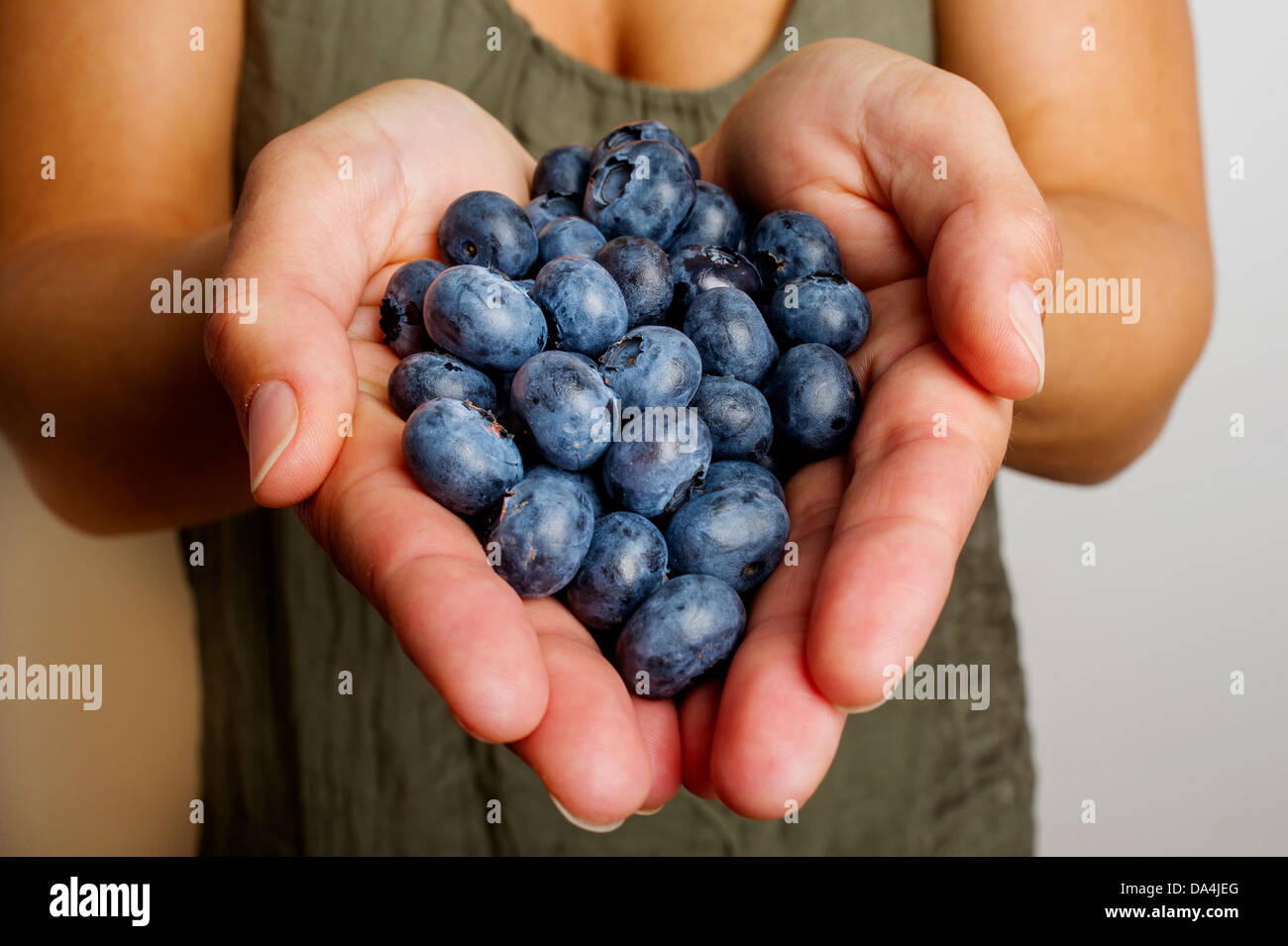 Hands holding blueberries hi-res stock photography and images - Alamy