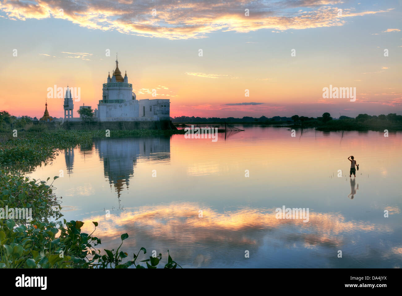 Buddhist temple sunset reflecting in hi-res stock photography and ...