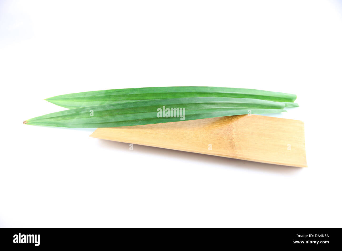 The Purple orchids and pandanus in bamboo dish on the white background ...