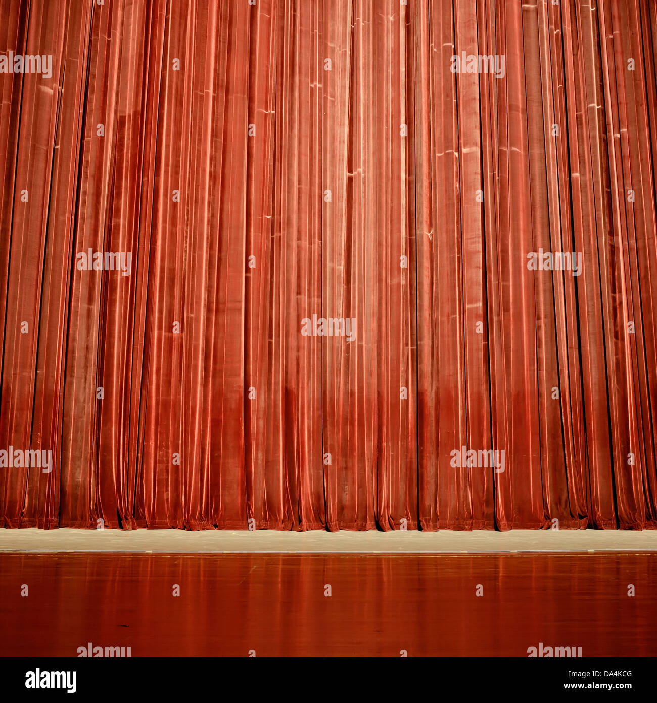 Pleated, red, hanging fabric stage curtain Stock Photo - Alamy
