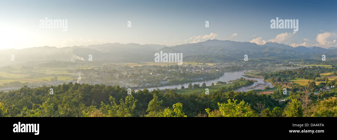 Panorama of green burmese countryside with village at river and ...