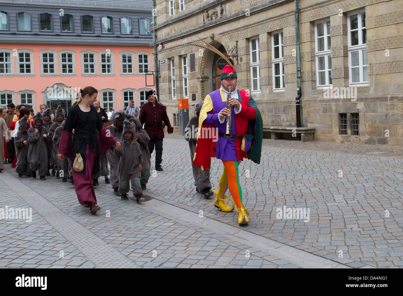 The Pied Piper leads the the players to the stage where they will ...