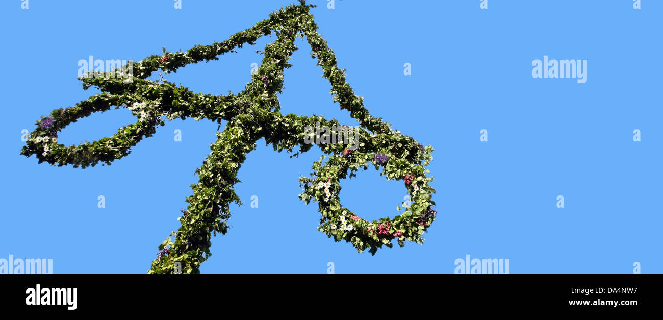 Maypole decorated with Swedish flag Stock Photo - Alamy