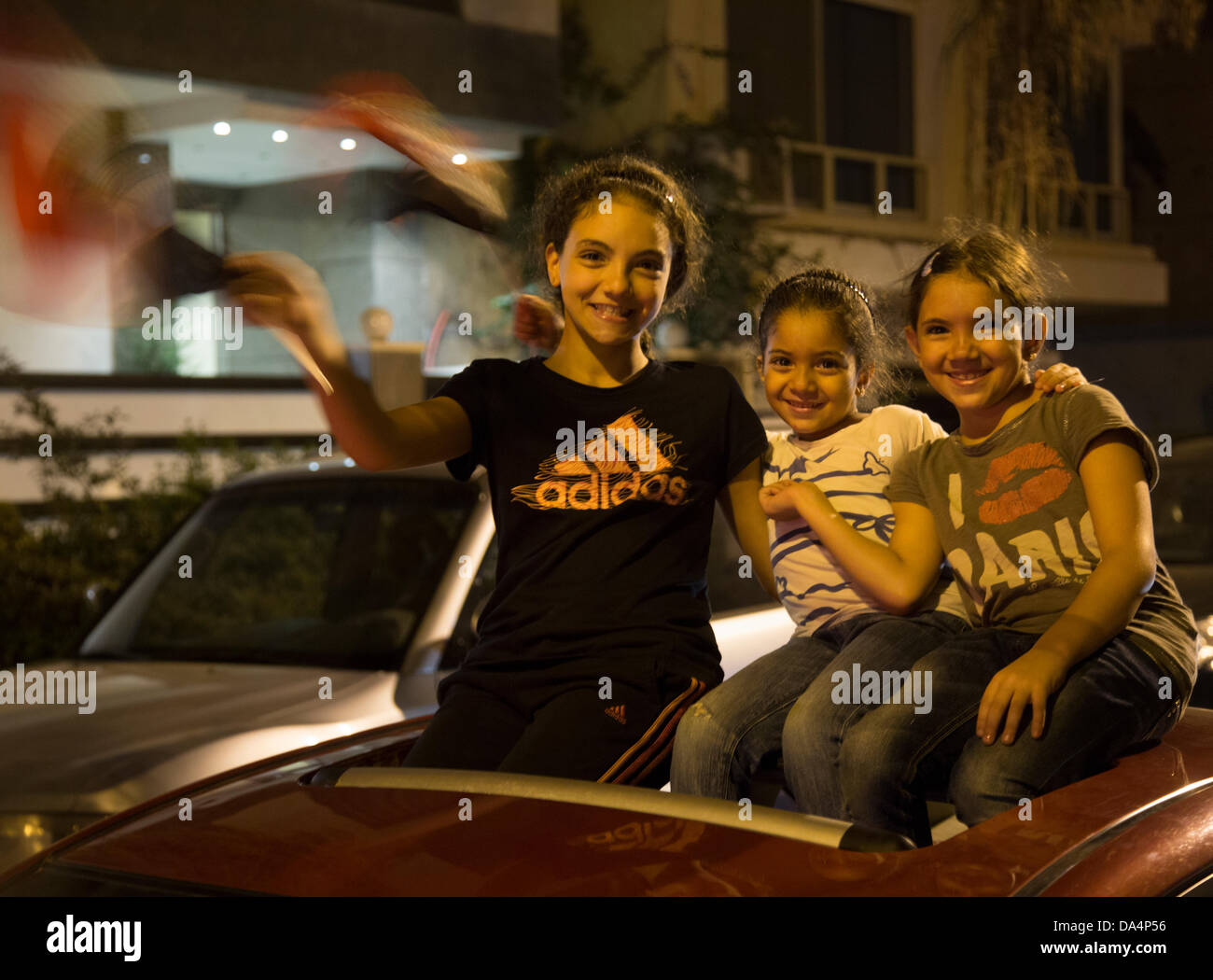 Egyptian Residents of Maadi suburb, Cairo, Egypt, celebrate the army ...