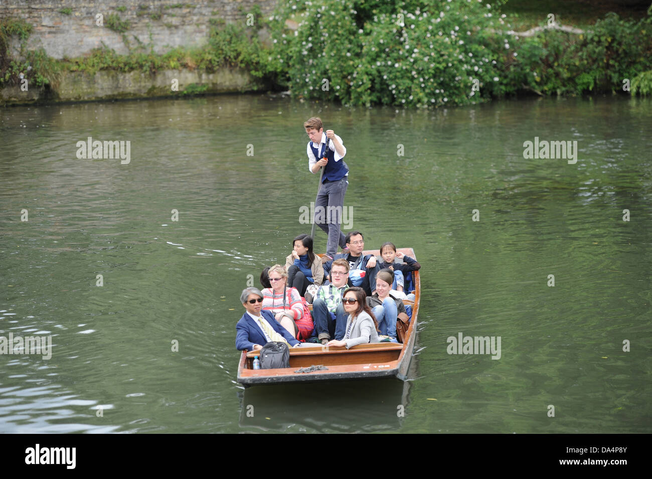 People on a sunny day punting on the River Cam in Cambridge Stock Photo ...
