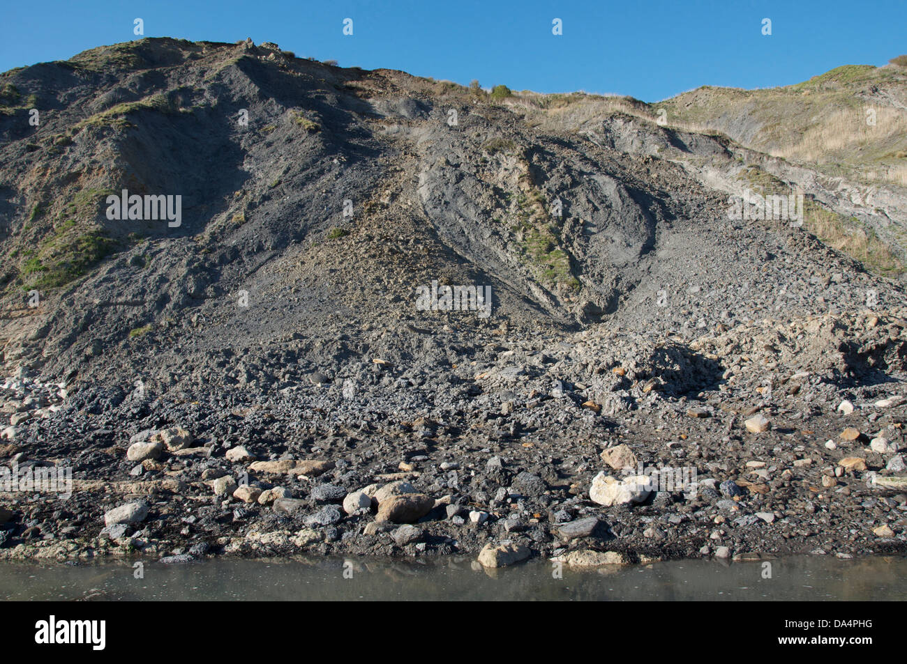 A scree of mudslide debris from a collapsed cliff at Black Head near ...