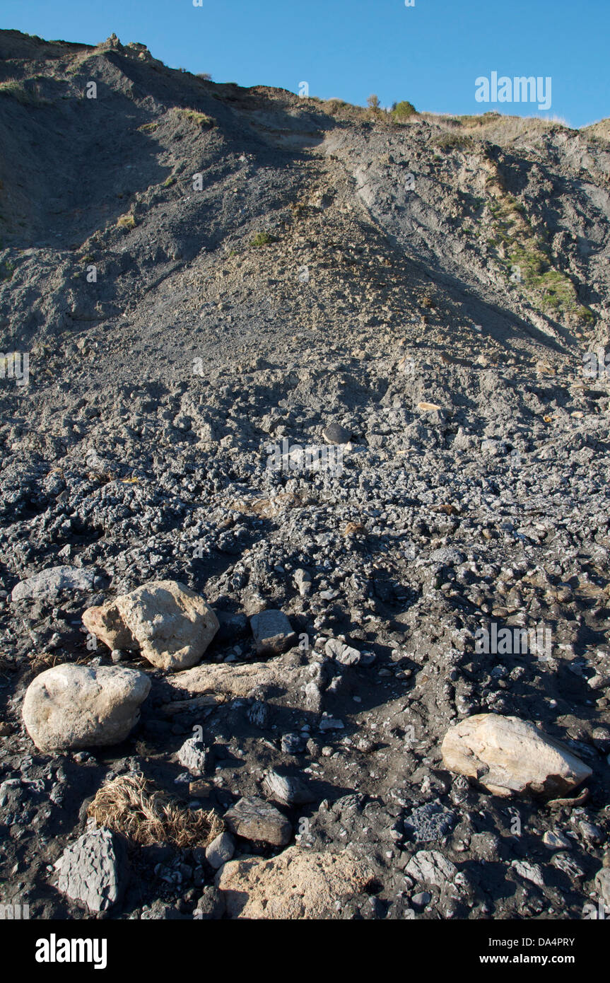 A scree of mudslide debris from a collapsed cliff at Black Head near ...