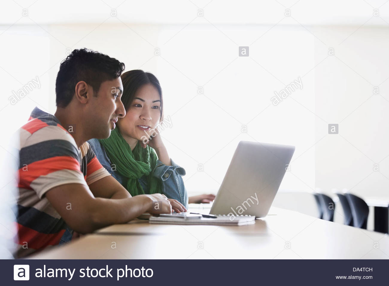 Side view of young students using computers in the computer room Stock ...