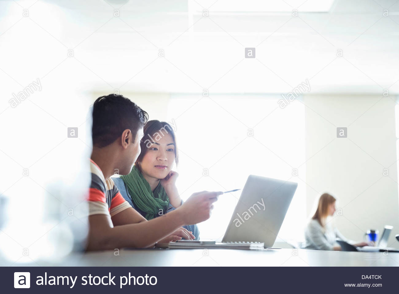 Students using laptops in classroom at college campus Stock Photo - Alamy