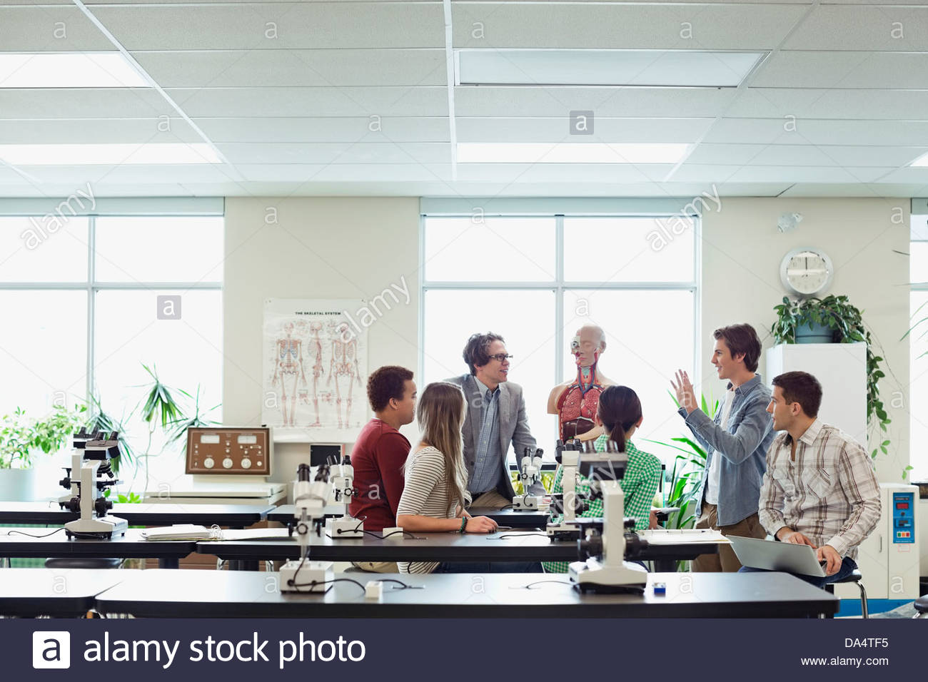 Teacher with students in science lab hi-res stock photography and ...