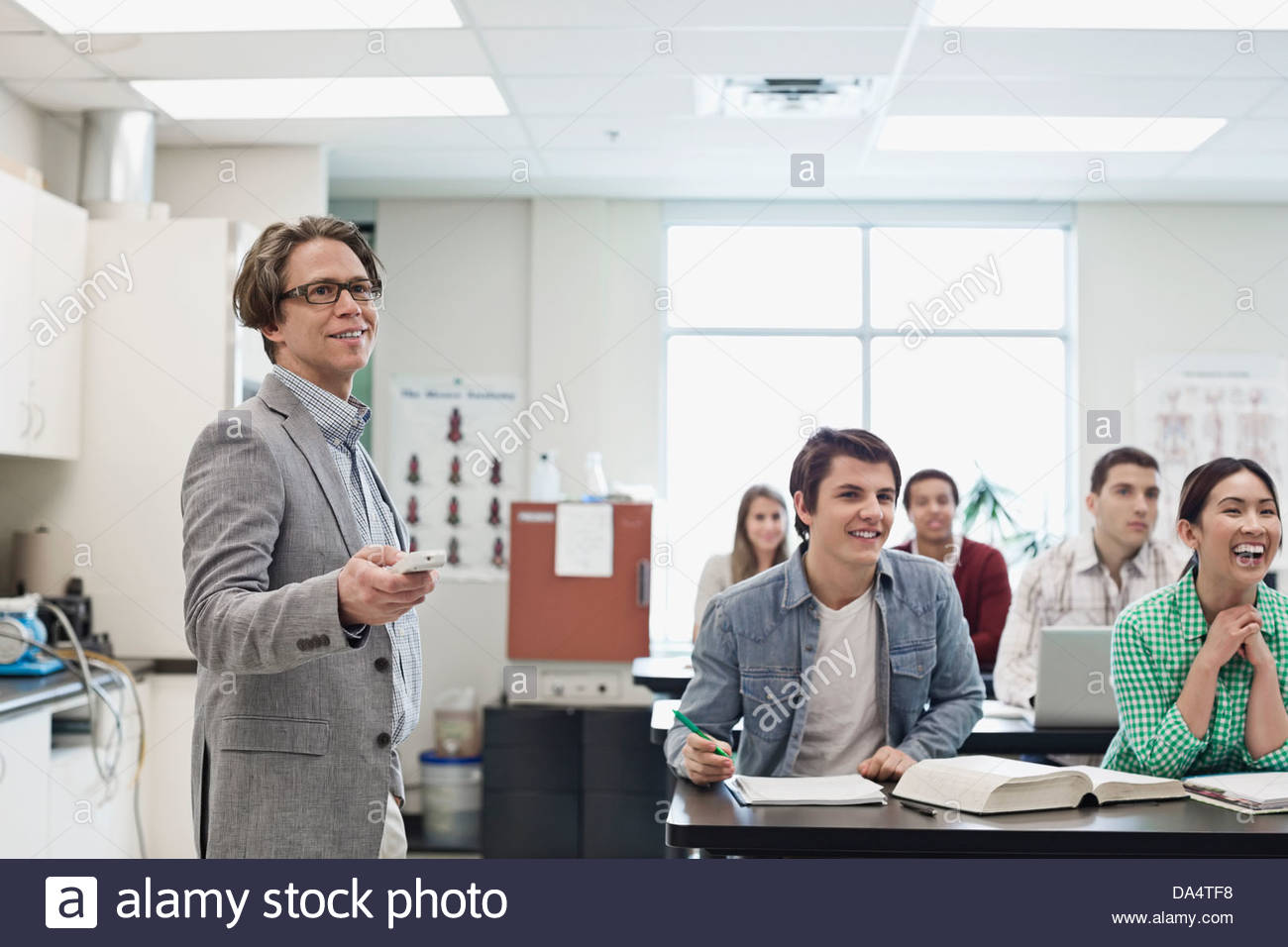 Male professor teaching students in college science lab Stock Photo - Alamy