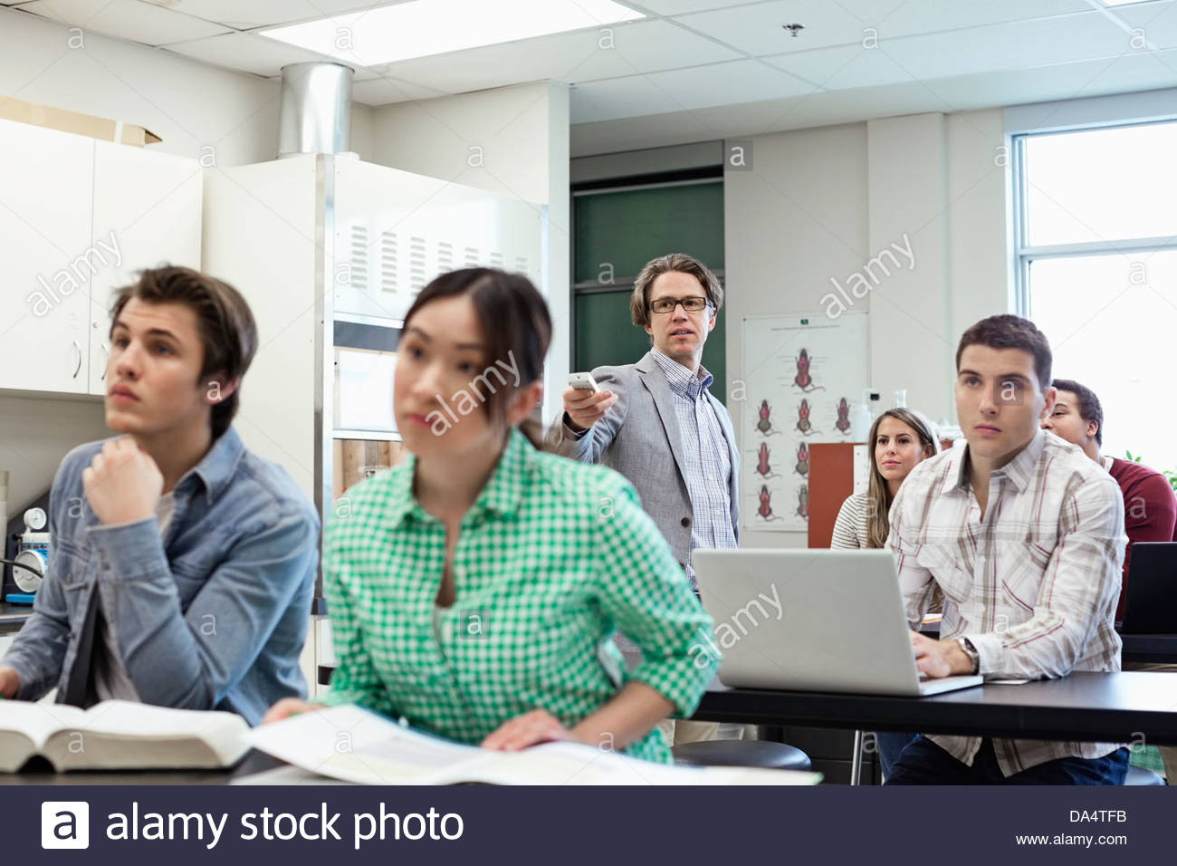 Serious teacher young with students hi-res stock photography and images ...