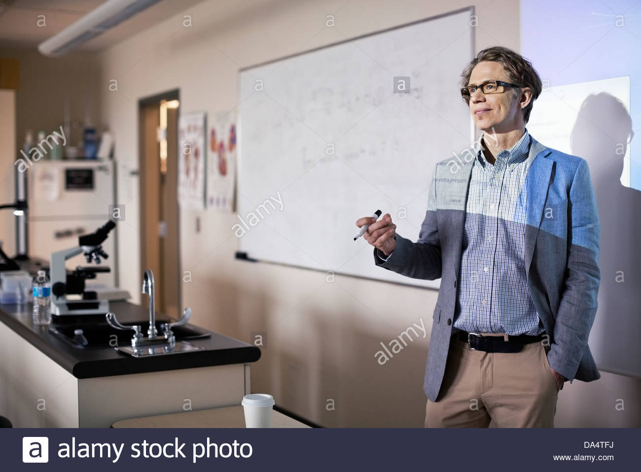 Male professor teaching in college science lab Stock Photo - Alamy