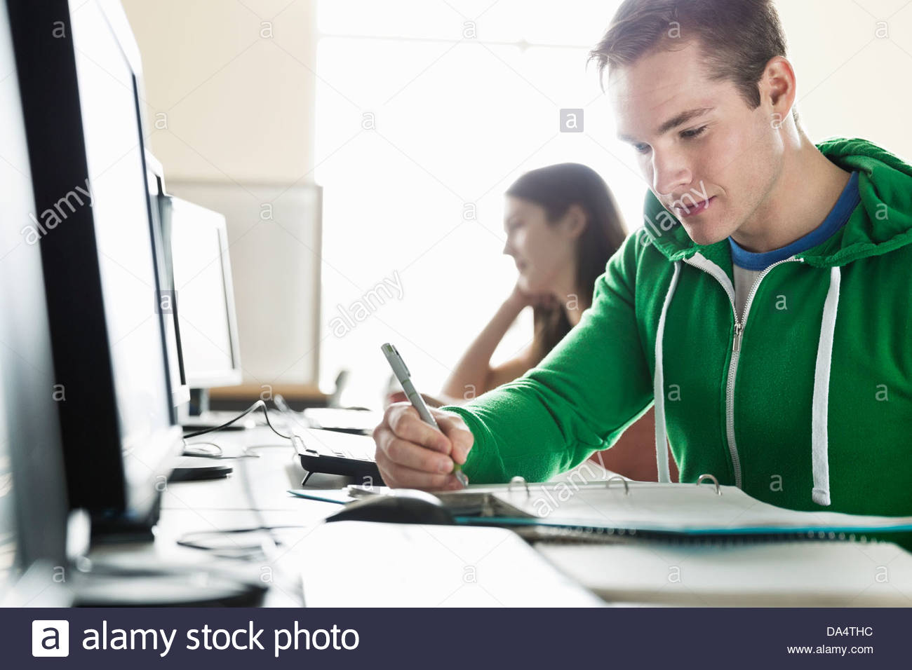 Students working on computers at college campus Stock Photo - Alamy