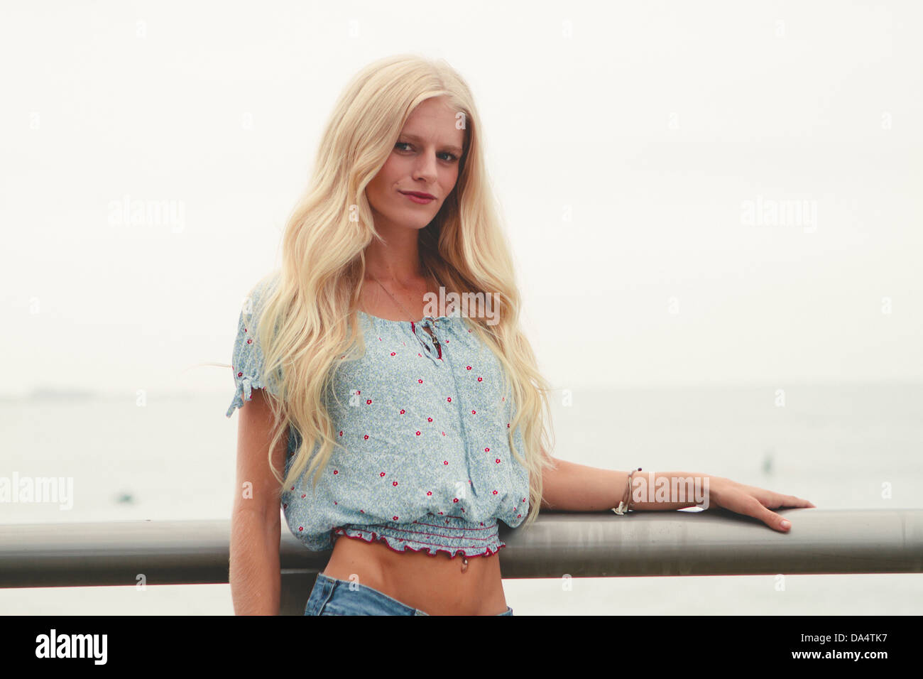 Beautiful young woman hanging hi-res stock photography and images - Alamy