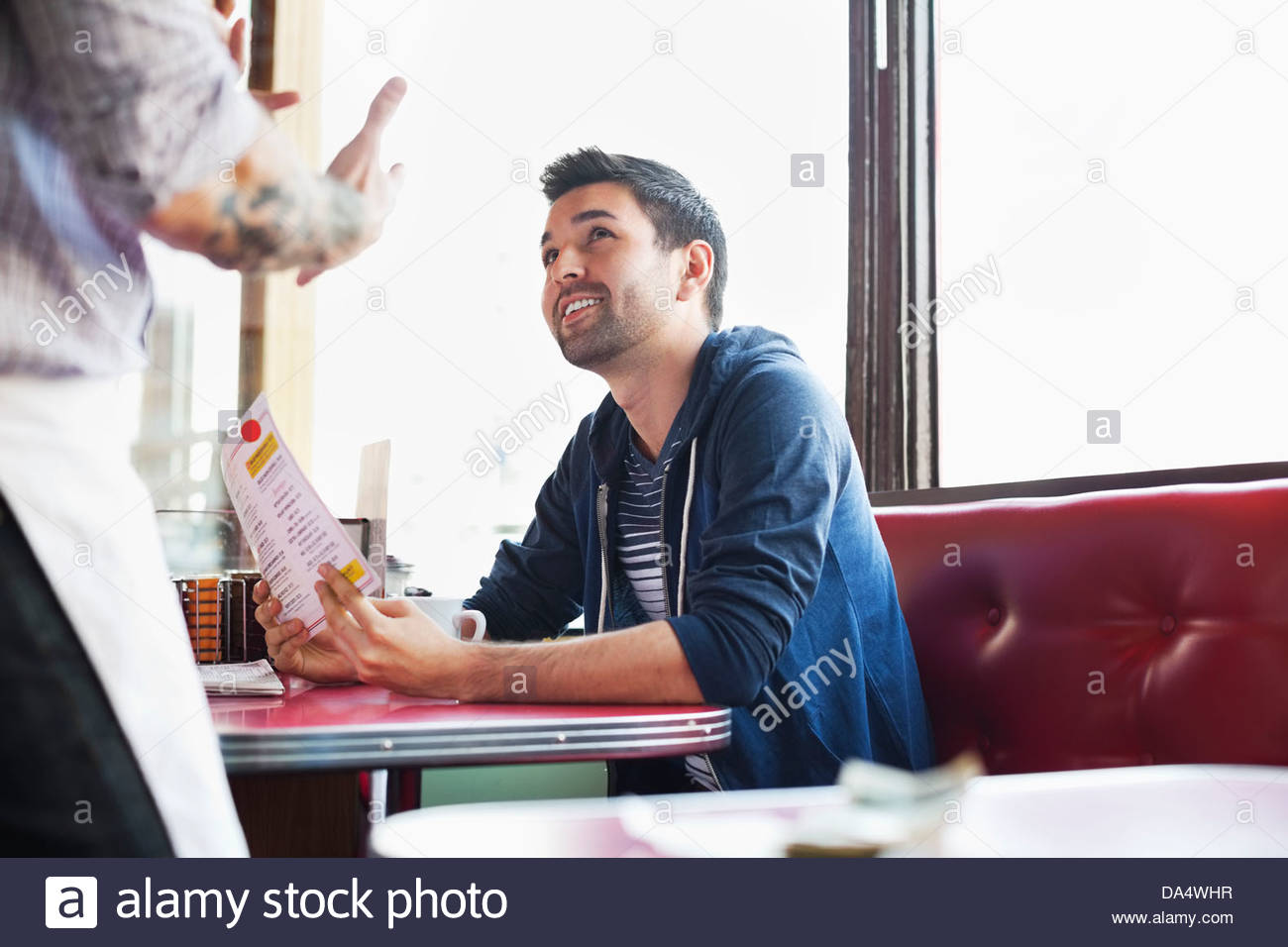 Small business retail food and drink holding sitting hi-res stock ...