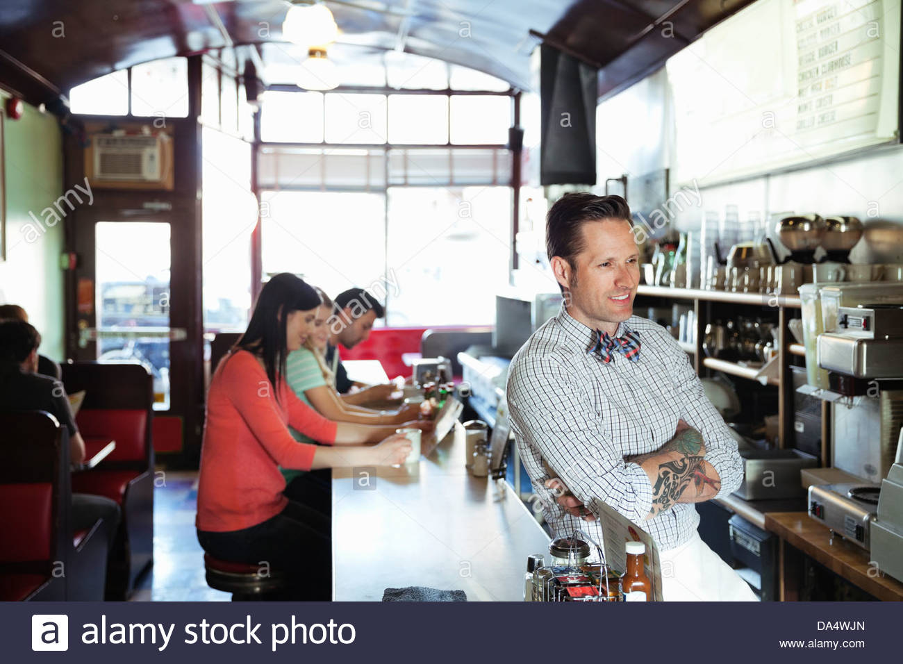 Leaning on counter hi-res stock photography and images - Alamy