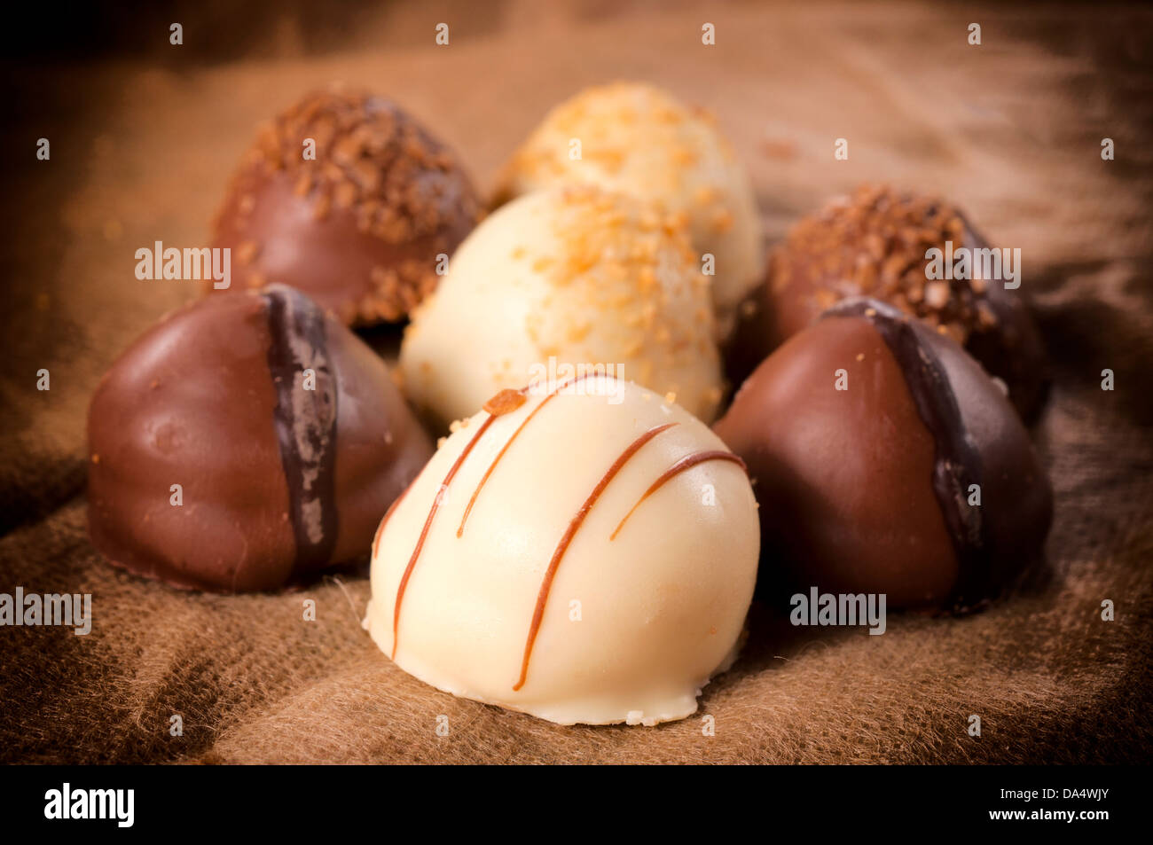 Dark and white chocolate pralines Stock Photo - Alamy