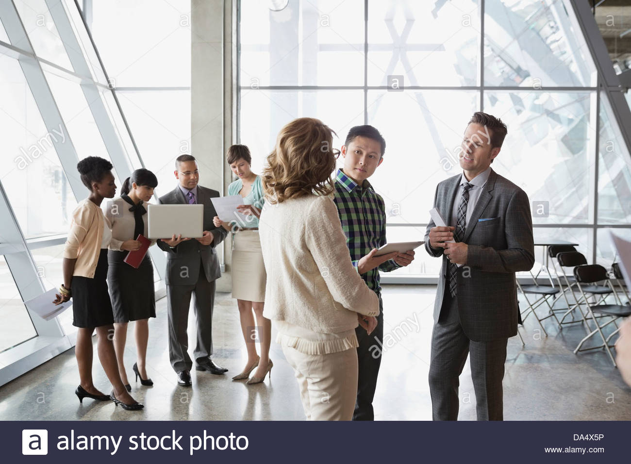 Group Of People Talking Standing
