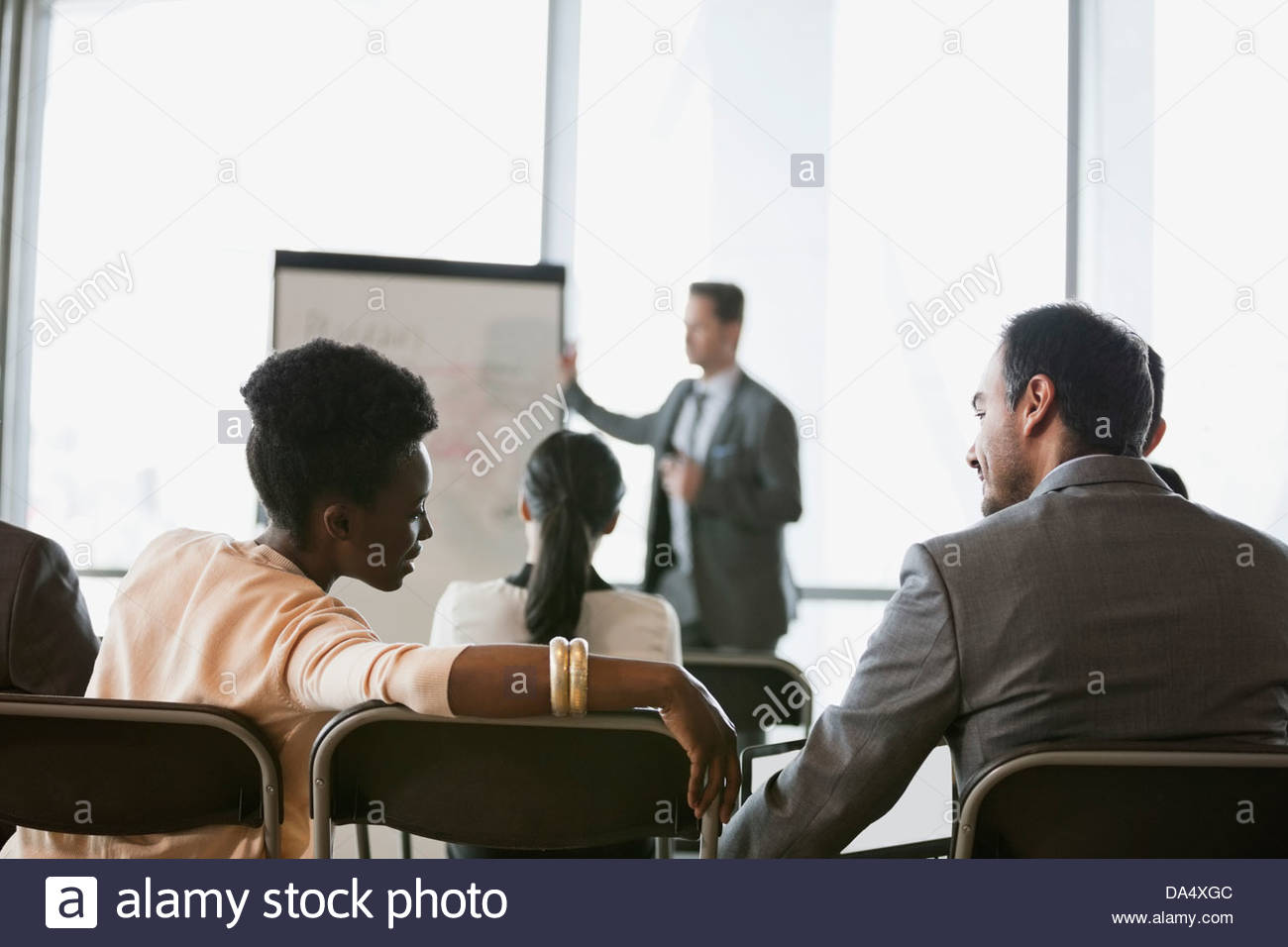 Business people talking during presentation in office building Stock ...
