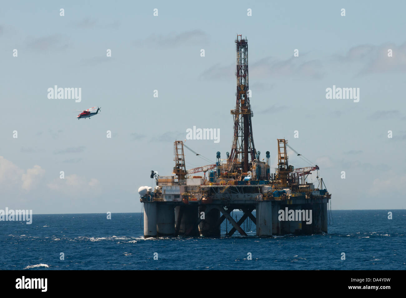 Helicopter departing from Falcon 100 oil drilling rig offshore Rio de ...