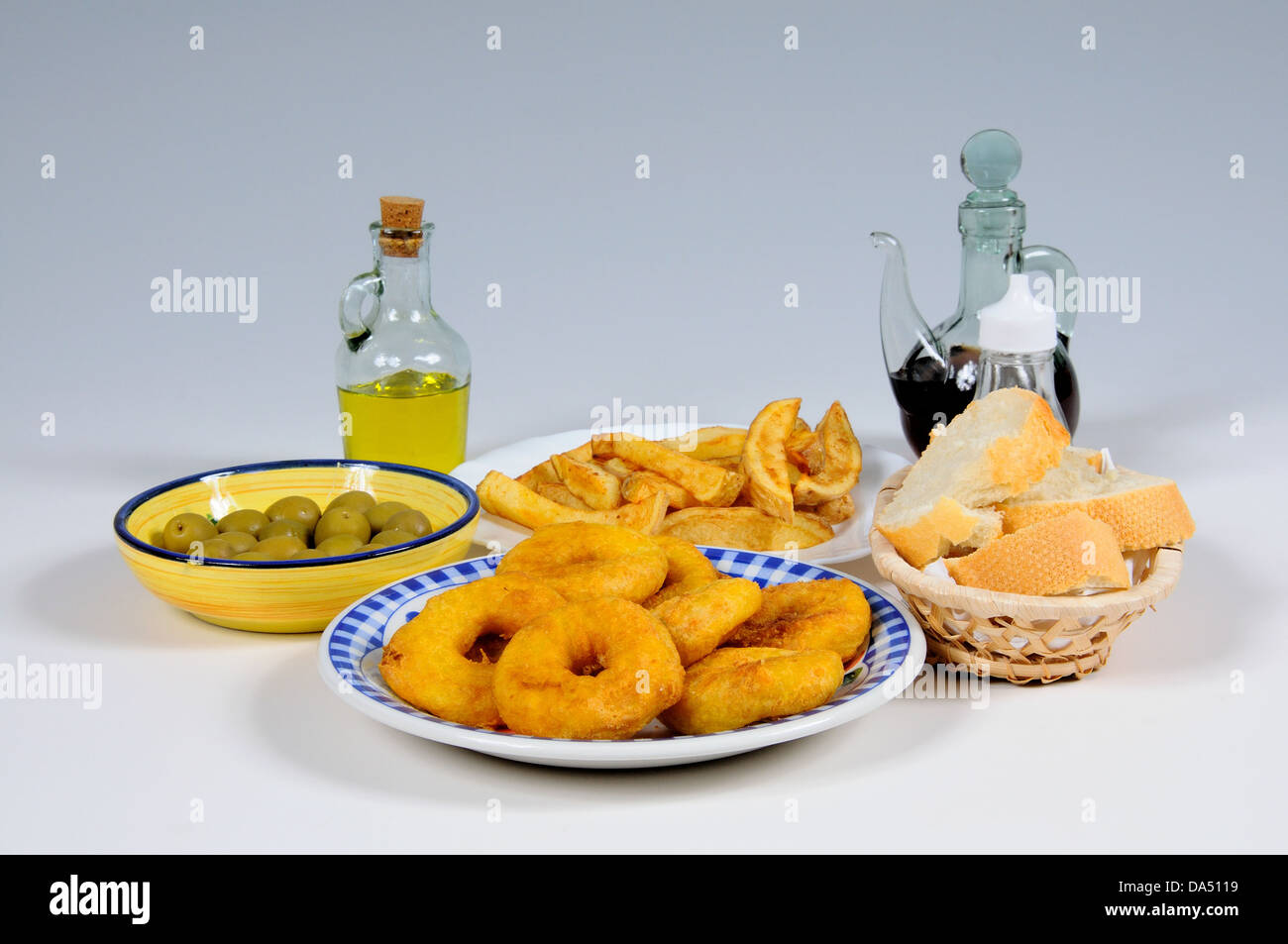 Tapas, Chips (Fries), Calamares (Squid rings), Green olives and bread ...