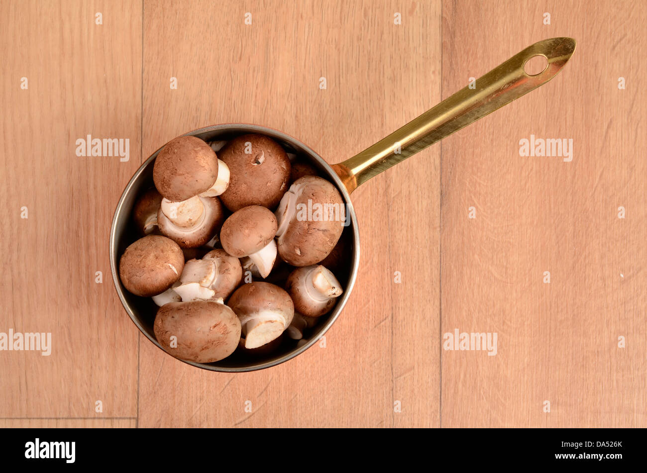 Fresh mushrooms in an old pan Stock Photo - Alamy