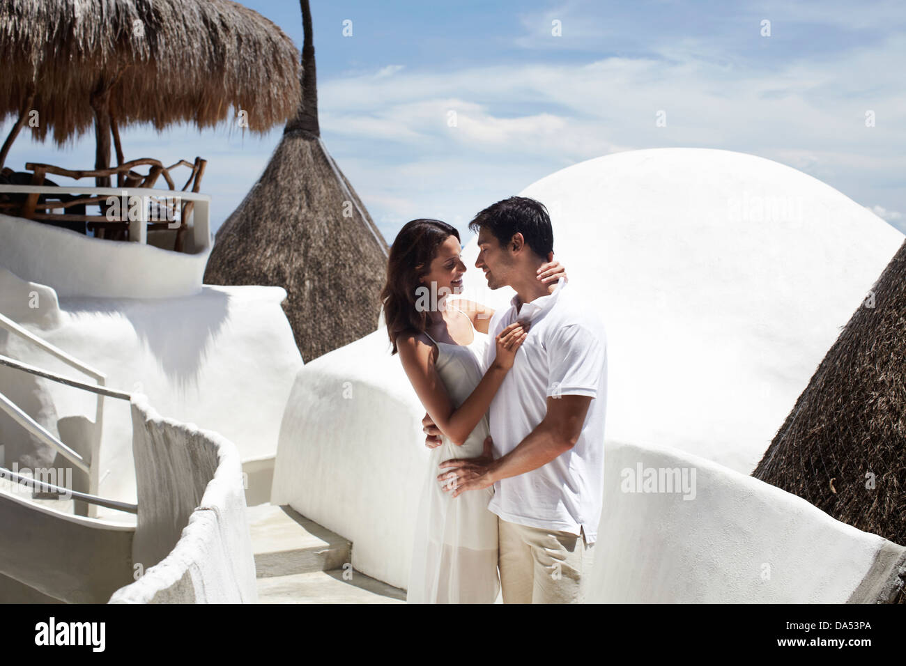 A young couple posing by the sea Stock Photo - Alamy