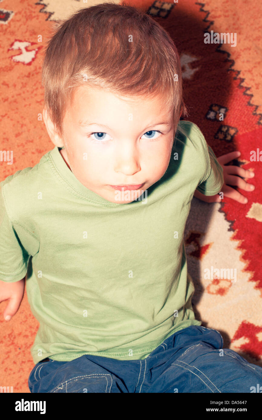 Boy sitting floor bedroom hi-res stock photography and images - Alamy
