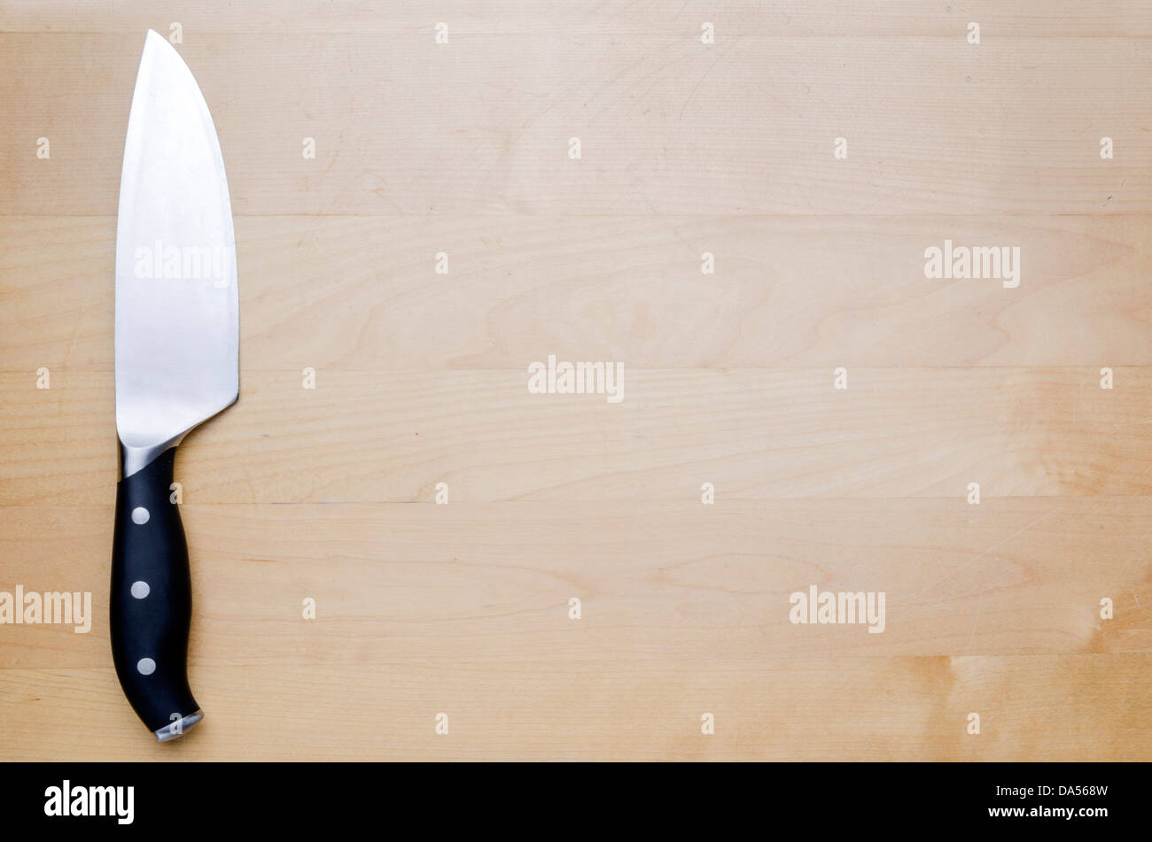 Wooden cutting board with kitchen knife Stock Photo - Alamy