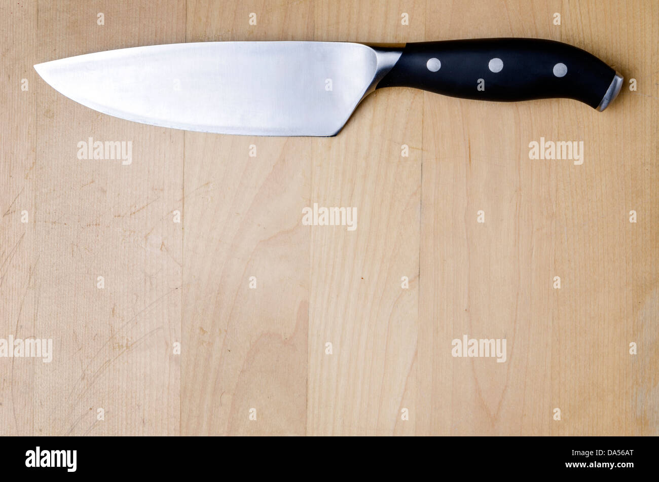 Wooden cutting board with kitchen knife Stock Photo - Alamy
