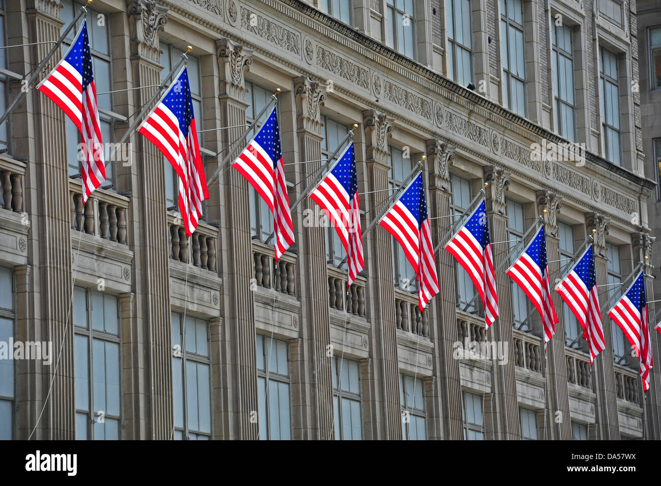 US flags on a building Stock Photo - Alamy