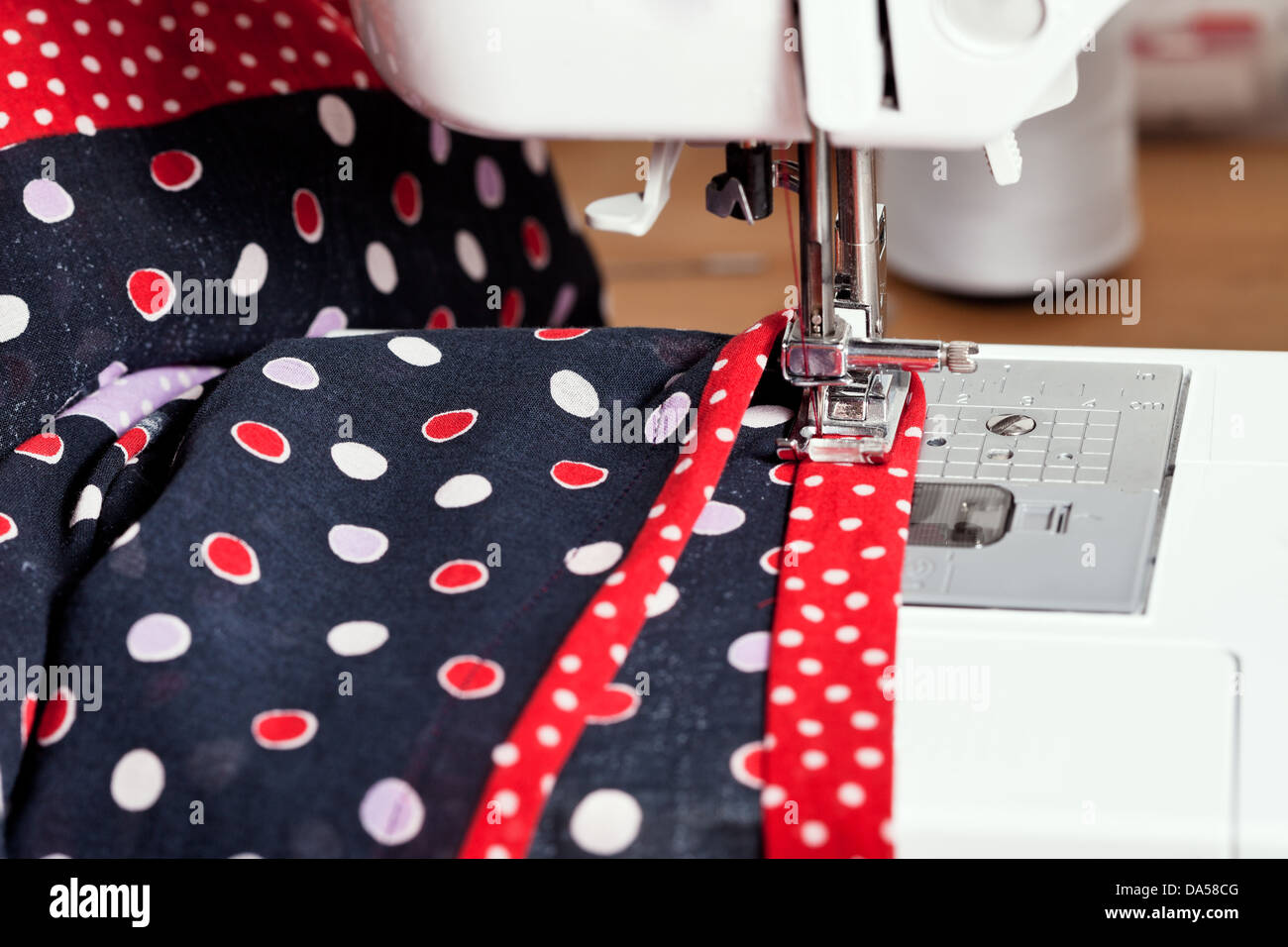 sewing clothes on sewing machine close up Stock Photo - Alamy